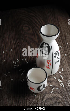 japan sake ceramic botle and cup with black background Stock Photo - Alamy