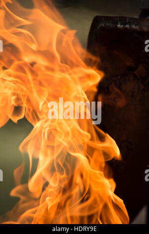 Close-up of flames shooting from grill Stock Photo - Alamy