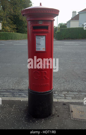 Old Post Office with red Georgian mail box and small local shop in old ...