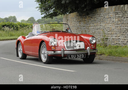 Red MGA hood down action shot Stock Photo - Alamy