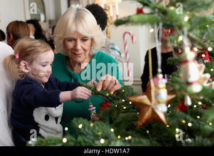 Two year old Violet Webster, who has a hole in the heart helps the ...