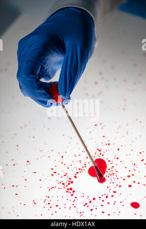 Forensic evidence. Swab sample from a crime sceneon top of a forensic ...