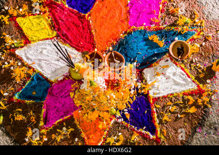A colorful mandala is made of colorpowder and candles for the Tihar ...