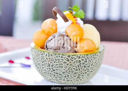 ice cream and melon in melon skin dish Stock Photo - Alamy