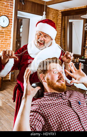 Santa claus as master at barber shop Stock Photo - Alamy