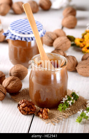 carob jam in glass jar with fruit around Stock Photo - Alamy