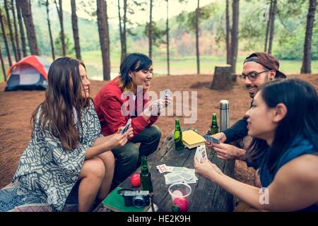 Friends Camping Playing Cards Concept Stock Photo - Alamy