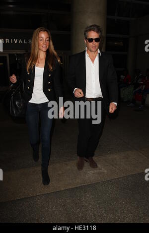 Hugh Grant arrives at the airport with his partner Featuring: Hugh ...