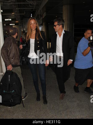 Hugh Grant arrives at the airport with his partner Featuring: Hugh ...