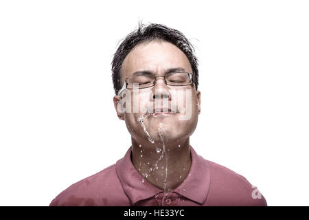 Facial expression : man spitting water Stock Photo - Alamy