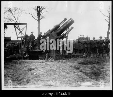 This historic image shows artillery pieces resting by the roadside ...