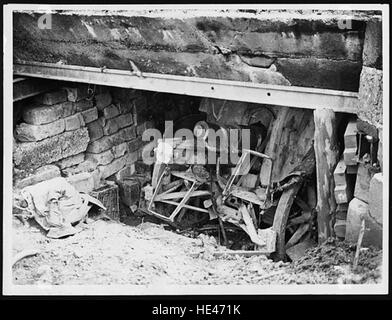 A German Boche gun in a concrete pit with one shell jammed in the ...
