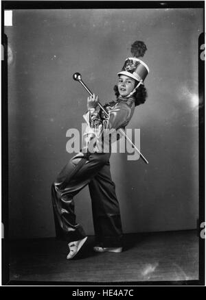 A historic image of a drum majorette, showcasing an aspect of ...