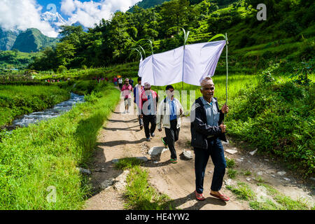 A procession of local farmers, carrying a death body to the cremation ...