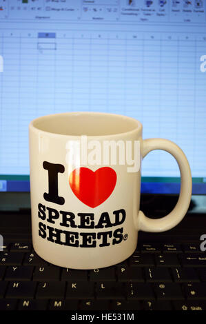 An "I love Spreadsheets" mug on a laptop keyboard Stock Photo - Alamy