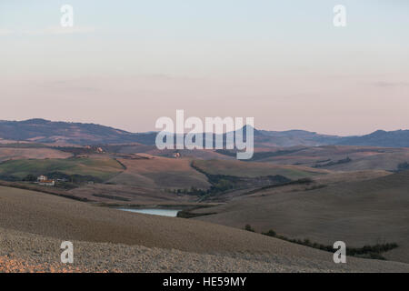 The thin soils of Tuscany ploughed at steep angles. Tuscan hills near ...