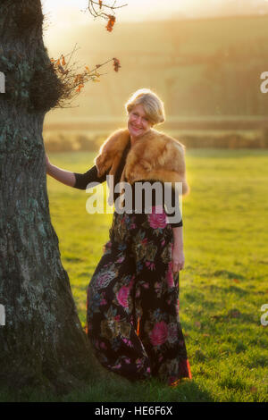 Middle age adult woman wearing winter sweater and chrismat hat over ...