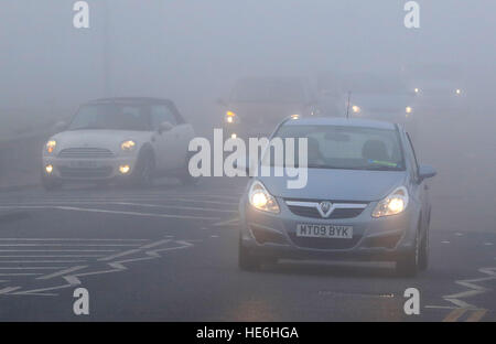 A car drives through thick fog on Tornaroy Road outside Belfast ...