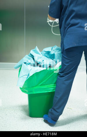 Operating theater surgery trash bin with green plastic bag used to ...