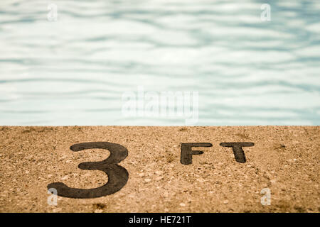 Depth sign by Swimming Pool Stock Photo - Alamy
