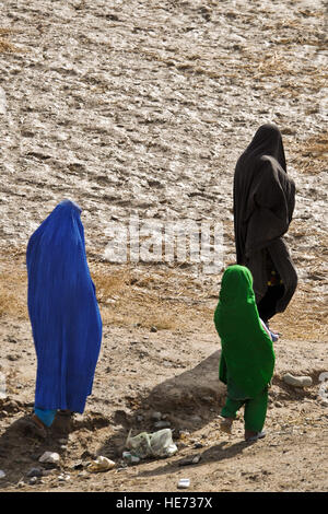 Law enforcement personnel walk near the scene following a shooting ...