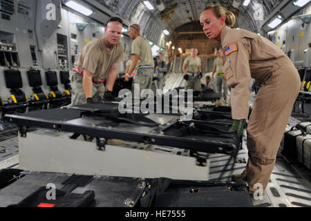 Tech. Sgt. Lindy Snodgrass, C-17 Globemaster III loadmaster, anchors ...