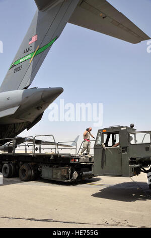 The new 60K Tunner Loader is marshaled off of a C-5 Galaxy marking the ...