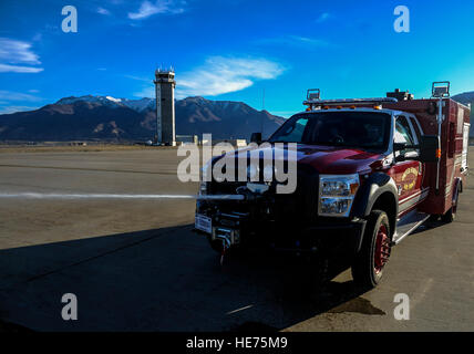 Air Force Fire Fighter Ernest Isley inspects his oxygen gauge at Hill ...