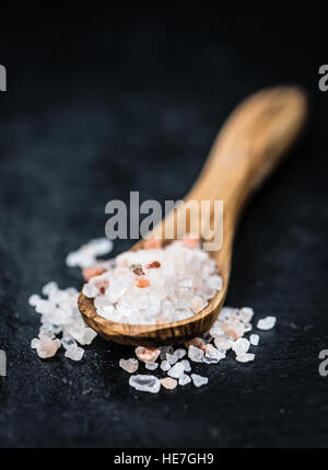 Portion of Himalayan Salt on a rustic slate slab (selective focus ...