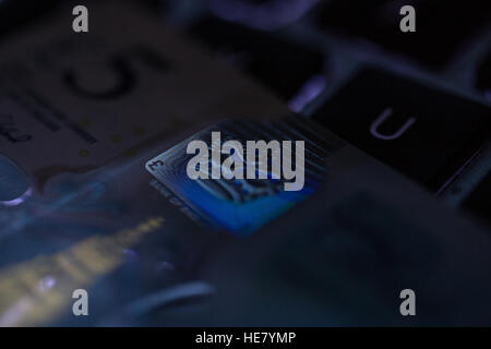 Low light photo showing the hologram and see through section of the new ...