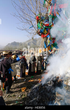 Lhasa: Tibetans attach new prayer flags to the Tibetan New Year (Losar ...