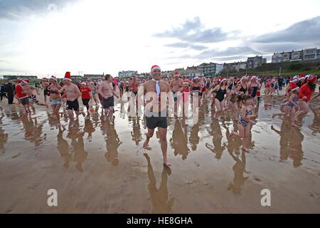 People at a charity Christmas swim at Portrush East Strand beach in Co ...
