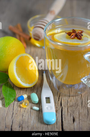 lemon tea, pills and thermometer on table Stock Photo - Alamy