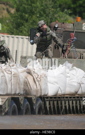 U.S. Army Spc. Ryan Lindberg, left, Spc. Michael Young, center, and ...