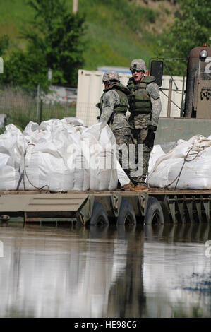 U.S. Army Spc. Ryan Lindberg, left, Spc. Michael Young, center, and ...