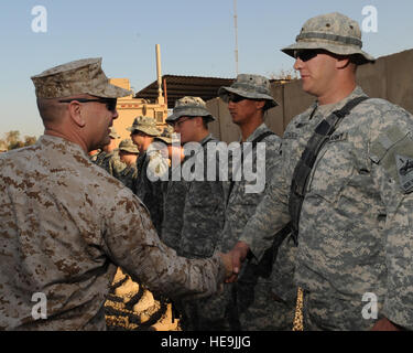 U.S. Marine Staff Sgt. Shawn Doty, right, watches President Bush's ...