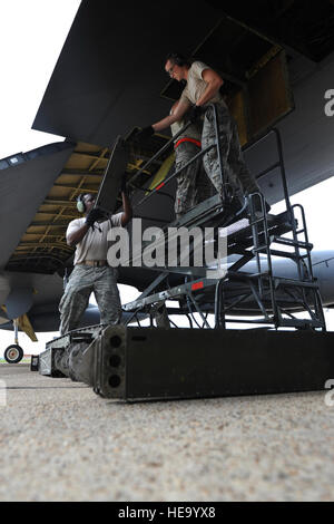 Airmen from the 2nd Aircraft Maintenance Squadron load CBU-103 ...