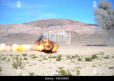 A U.S. Marine Corps M58 Mine Clearing Line Charge (MICLIC) fires a ...