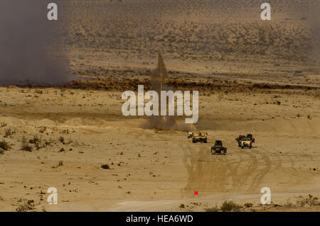 A U.S. Marine Corps M58 Mine Clearing Line Charge (MICLIC) fires a ...
