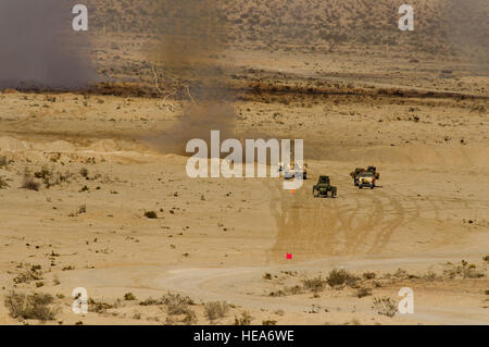 A U.S. Marine Corps M58 Mine Clearing Line Charge (MICLIC) fires a ...