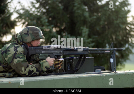 US Army M60 machine gun with amminition tape on position isolated on ...