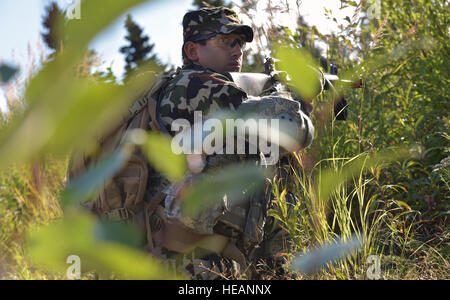 A Nepalese Army Ranger pulls security for his squad of U.S. Army ...