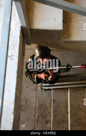 Afghan National Army officer trainees practice building entry and ...