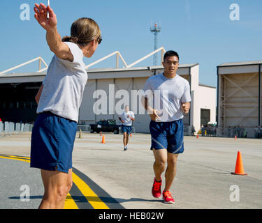 U.S. Air Force Col. Josh Koslov, 350th Spectrum Warfare commander, left ...