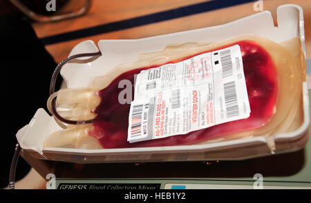 blood bag in a blood collection mixer machine Stock Photo - Alamy
