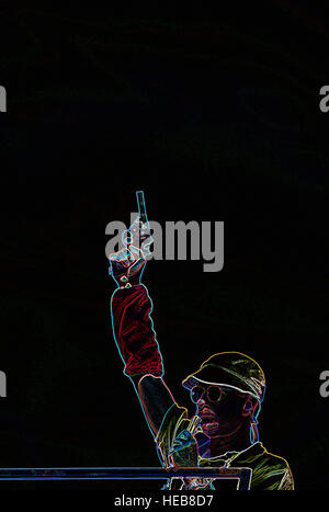 Race official holding a starting gun at the beginning of a track event ...