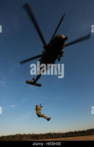 An Air Force pararescueman is hoisted to an HH-60 Pave Hawk during a mission in Afghanistan ...