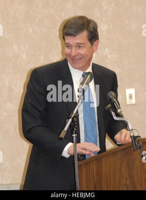 North Carolina Attorney General Roy Cooper gestures while speaking at ...