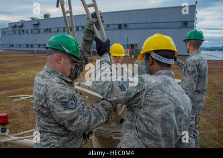 U.S. Airmen with the 52nd Combat Communications Squadron work together ...