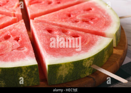 slices of fresh watermelon on a stick macro. Horizontal top view Stock ...